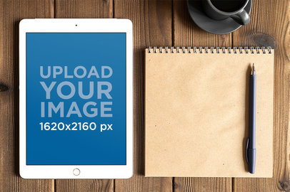 Placeit - iPad Mockup Featuring a Square Notebook Against a Wooden Surface