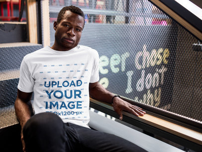 Placeit - Mockup of a Guy Wearing a Round Neck Tee Template While ...