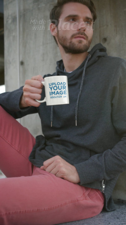 Placeit - Video of a Serious Man Holding an 11 oz Coffee Mug