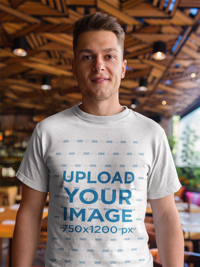 Placeit - T-Shirt Template Being Worn by a Dude at a Restaurant