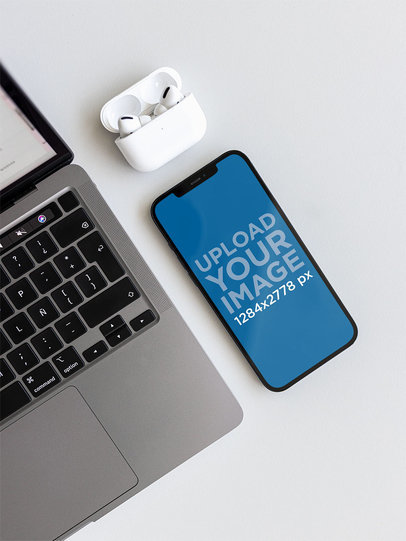 Placeit - Mockup of an iPhone 12 Pro Max Placed by a Computer and Some ...