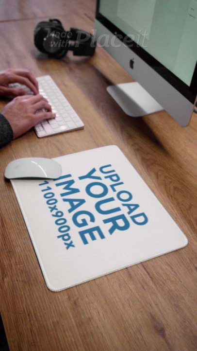 Placeit - Mousepad Video Featuring a Wooden Desk and a Man Working On ...