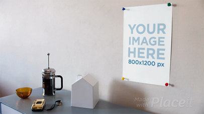 Placeit - Moving Objects On a Table Below a Poster on the Wall in Stop ...