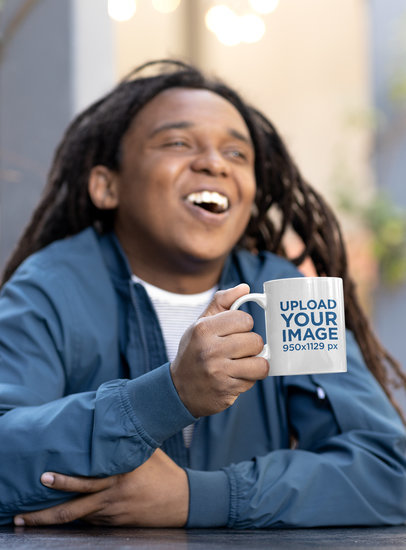 Placeit - Mockup of a Happy Man With a Blue Jacket Holding a Mug