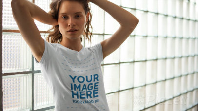 Placeit - Blonde Young Woman Posing Against a Window Wearing a T-Shirt ...