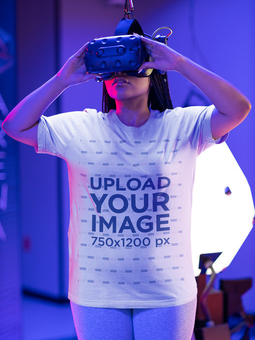 Placeit - Mockup of a Gamer With an Oversized Tee Playing With a VR Headset