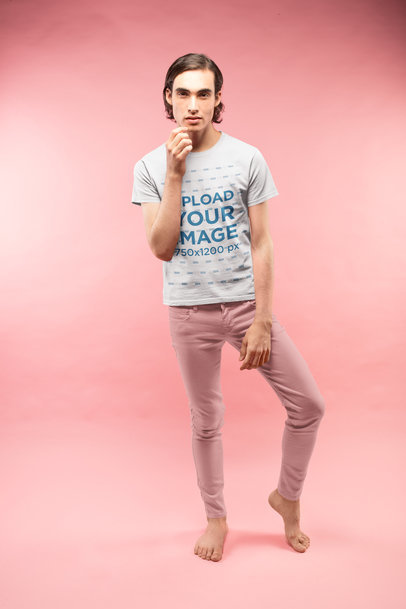 Placeit - Man Posing Wearing a Tshirt Mockup in a Pink Room