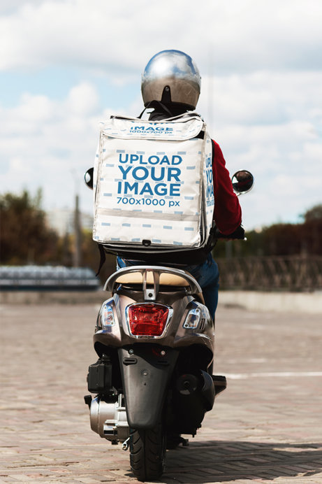 Placeit - Delivery Backpack Mockup Featuring a Man Riding a Motorbike