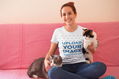 Placeit - Happy Cat Lady Wearing a T-Shirt Mockup Sitting on her Sofa