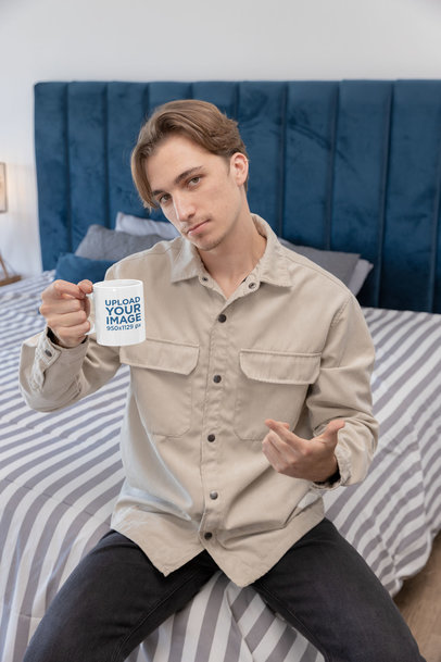 Placeit - Mockup of a Serious Man Holding an 11 Oz Mug While Posing for ...