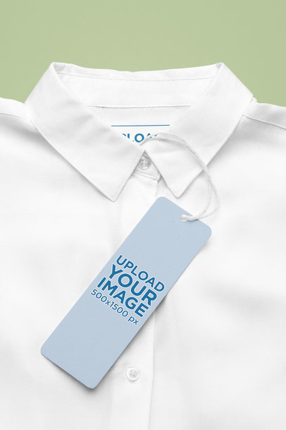 Placeit - Mockup of a Brand Tag Hanging From a Button-Up Shirt