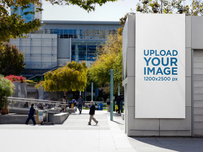 Placeit - Mockup of a Vertical Banner on a Building Wall