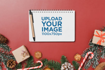 Placeit - Christmas-Themed Mockup of a Notebook Lying on a Red ...