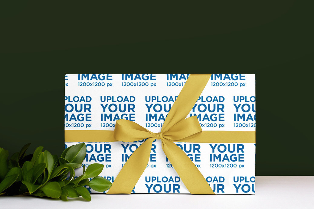 Placeit - Wrapping Paper Mockup Featuring a Gift and Some Leaves
