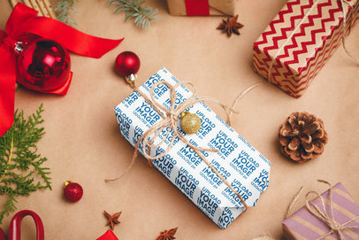 Placeit - Wrapping Paper Mockup Featuring a Gift for Christmas Season