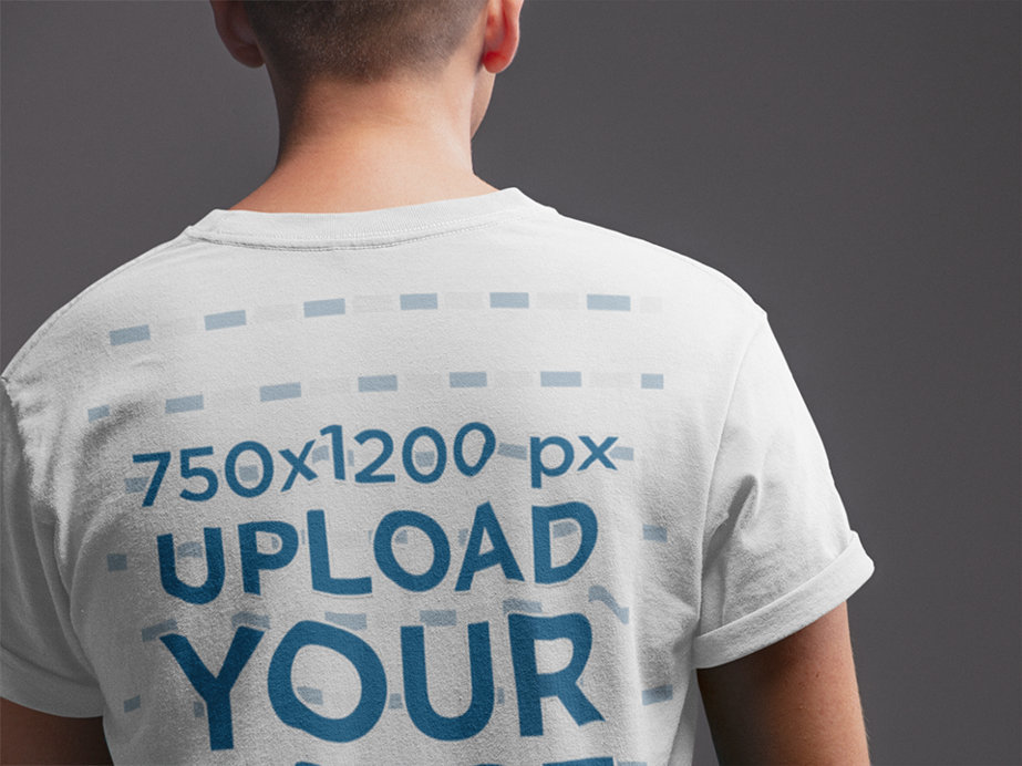 Placeit - Back Shot T-Shirt Mockup of a Man in a Gray Room