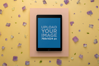 Placeit - Mockup of an iPad Laying Next to Pretty Flowers Over ...