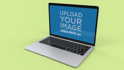 Placeit - Mockup of a Silver MacBook Air Over a Solid Surface