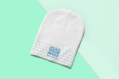 Placeit - Mockup of a Knit Beanie Laying Flat on a Surface with Two Colors