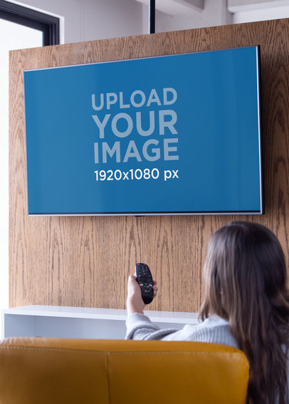 Placeit - Mockup of a Woman Watching Her Smart TV in a Comfy Living Room
