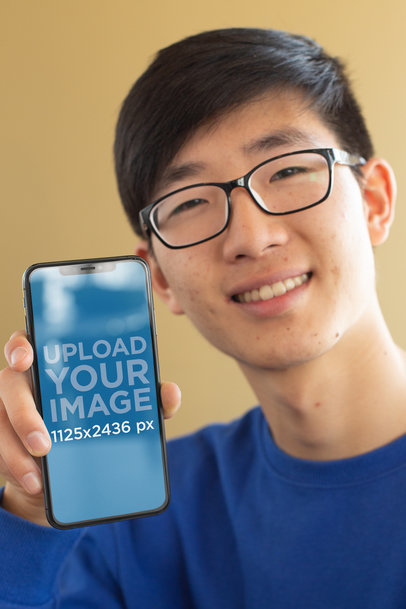 Placeit - iPhone 11 Pro Mockup of a Smiling Man with Glasses