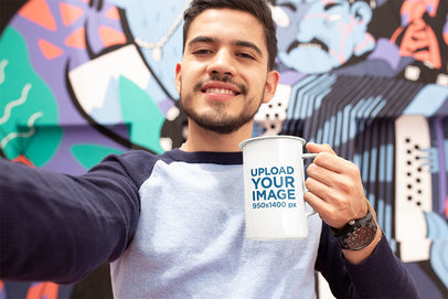 Placeit - Mockup of a Man Taking a Selfie with a 21oz Enamel Coffee Mug
