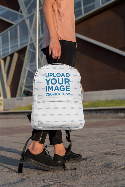 Placeit - Backpack Mockup Being Carried by a Man at an Urban Scenario