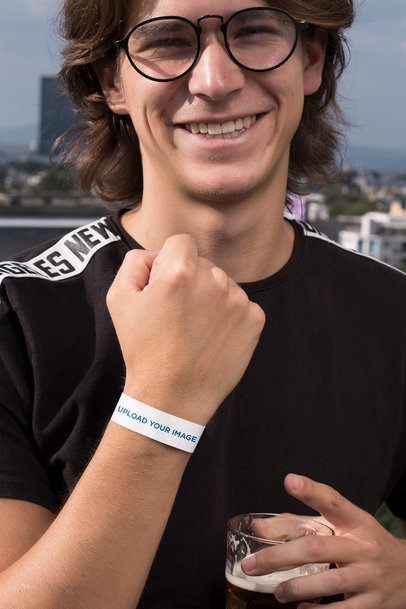 Placeit - Paper Wristband Mockup Featuring a Man Holding a Beer