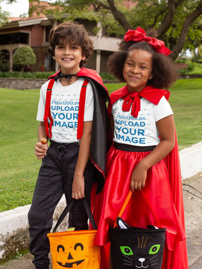 Placeit - T-Shirt Mockup of a Two Kids Dressed in Halloween Costumes