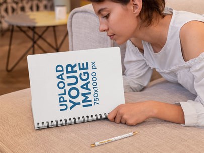 Placeit - Spiral Notebook Mockup Featuring a Woman Reading