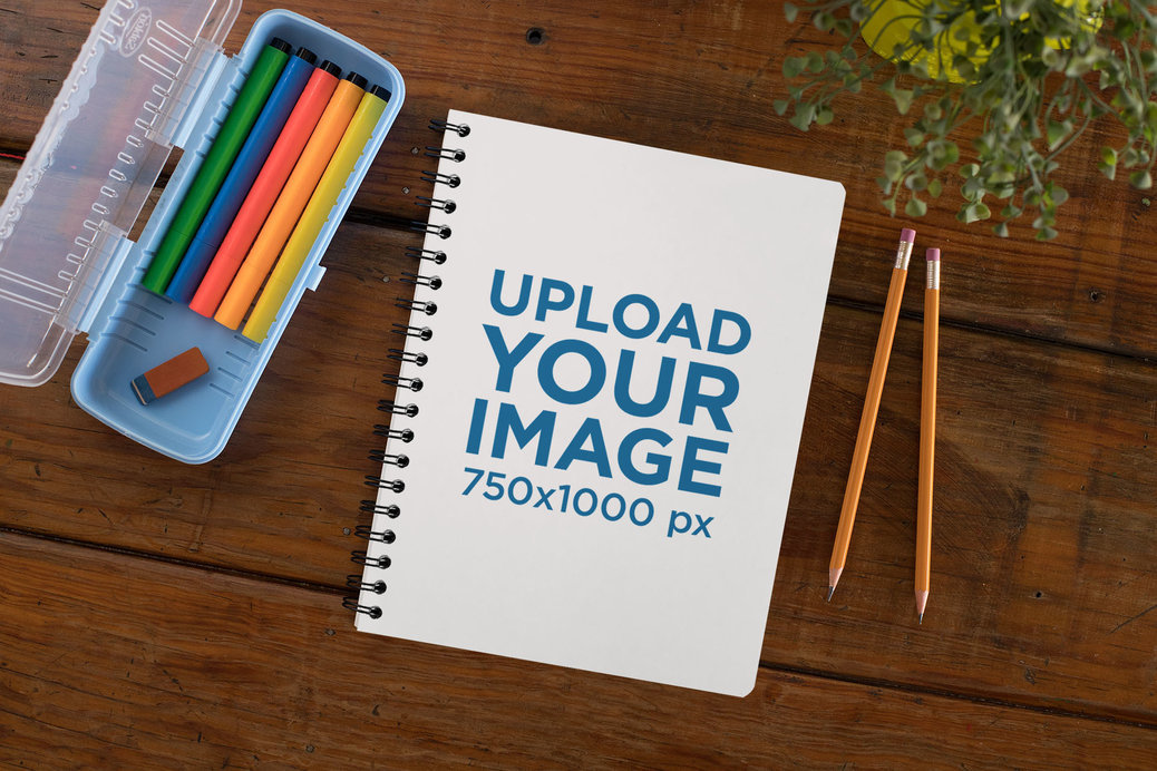 Placeit - Mockup of a Spiral Notebook Over a Wooden Surface