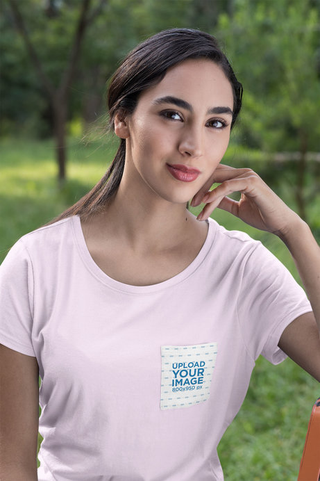 Placeit - Pocket Tee Mockup of a Young Woman at a Park