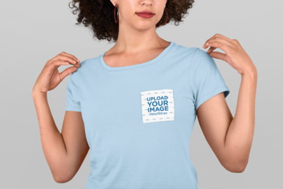 Placeit - Cropped Face Pocket Tee Mockup of a Woman with Curly Hair