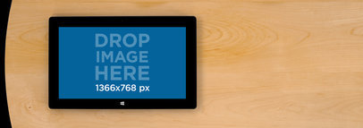 Placeit - Microsoft Surface Over a Table Wide Shot Mockup