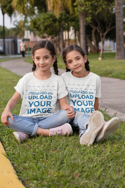 Placeit - T-Shirt Mockup Featuring Twin Sisters at the Park