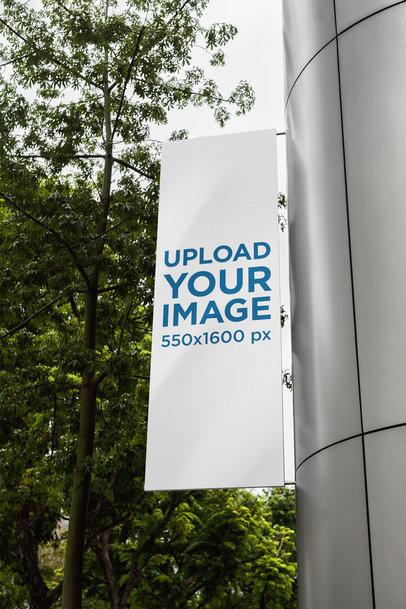 Placeit - Mockup of a Vertical Banner Attached to a Modern Building