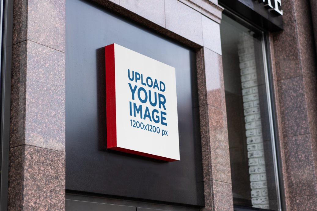 Placeit - Mockup of a Square Sign on a Modern Building's Facade