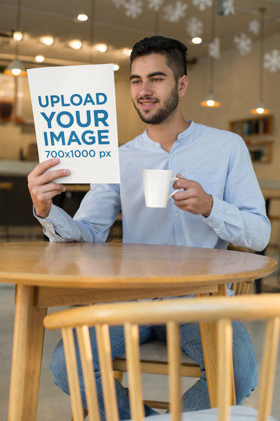 Placeit - Mockup of a Smiling Man Reading a Magazine at a Cafe