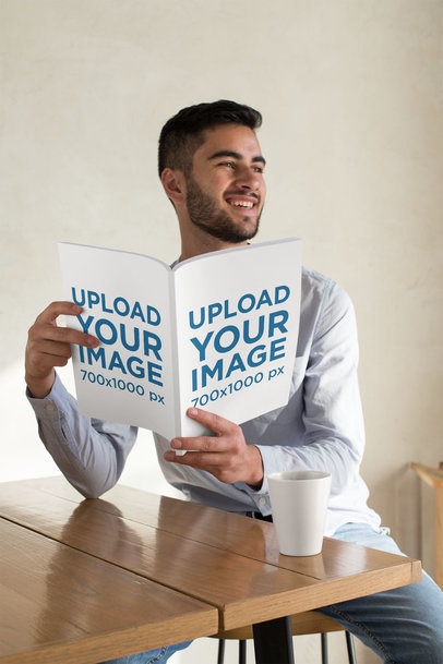 Placeit - Mockup of a Man Reading a Magazine