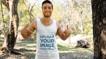 Placeit - Video of a Smiling Man Pointing at His Tank Top