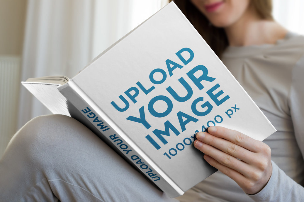 Placeit - Hardcover Book Mockup of a Woman Reading