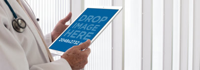 Placeit - iPad Mockup of a Senior Doctor Holding his iPad Pro