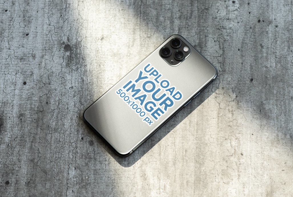 Placeit - Sticker Mockup of an iPhone 11 Pro Placed on a Solid Surface