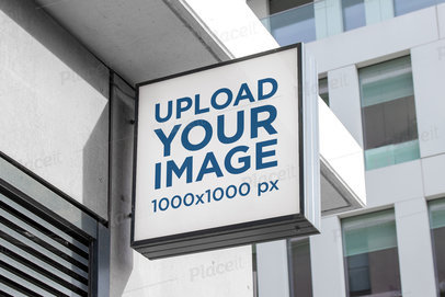 Placeit - Mockup of a Square Sign Placed Outside a Store