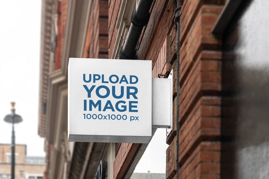 Placeit - Outdoor Sign Mockup Featuring a Brick Facade