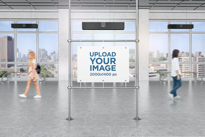 Placeit - Mockup of a Horizontal Poster in a Public Corridor