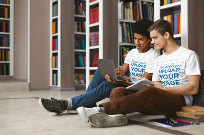 Placeit - T-Shirt Mockup Featuring Two Students Reading in a Library