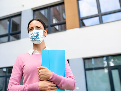 Placeit - Face Mask Mockup Featuring a Woman at Work