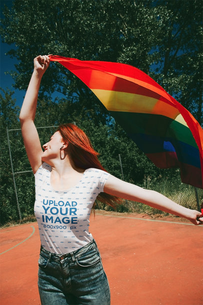 Placeit - Sublimated Tee Mockup of a Happy Woman Waving a Pride Flag