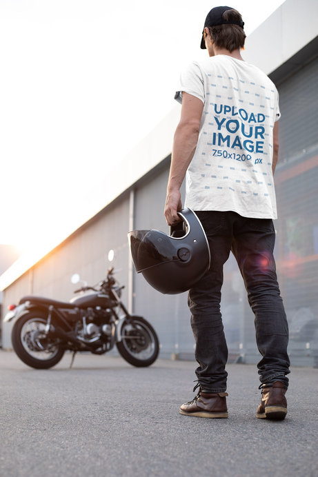 Placeit - Back T-Shirt Mockup of a Man About to Ride His Bike